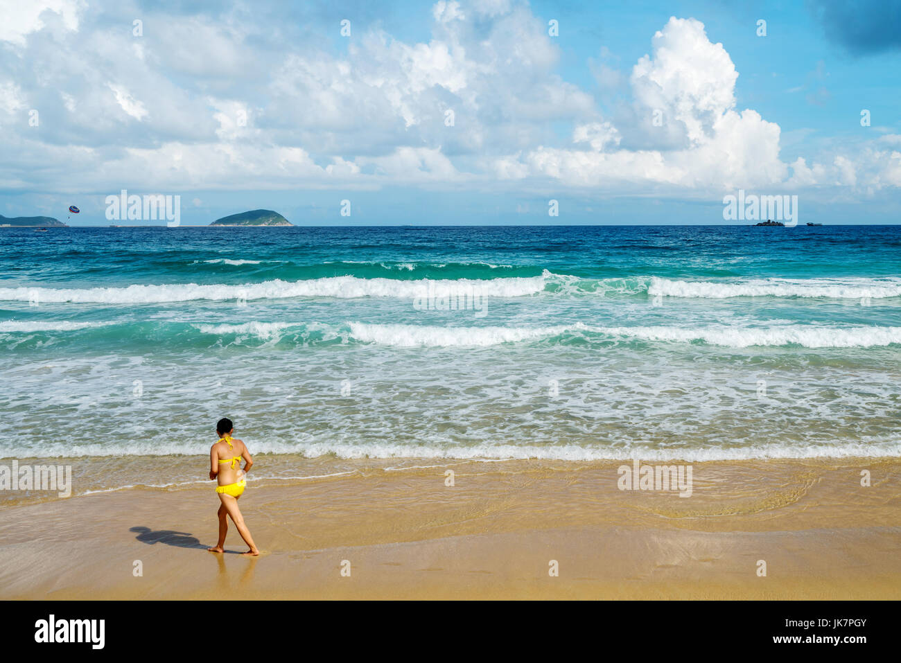Blue ocean and pretty girl, China Hainan Yalong Bay Stock Photo - Alamy