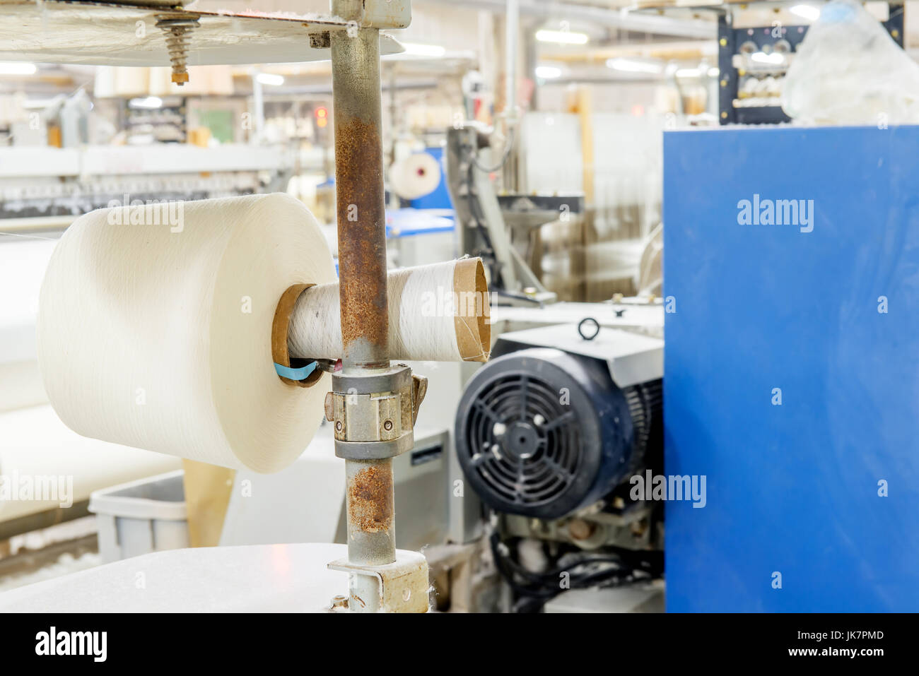 Detail of string reels in factory,blue tone map Stock Photo - Alamy