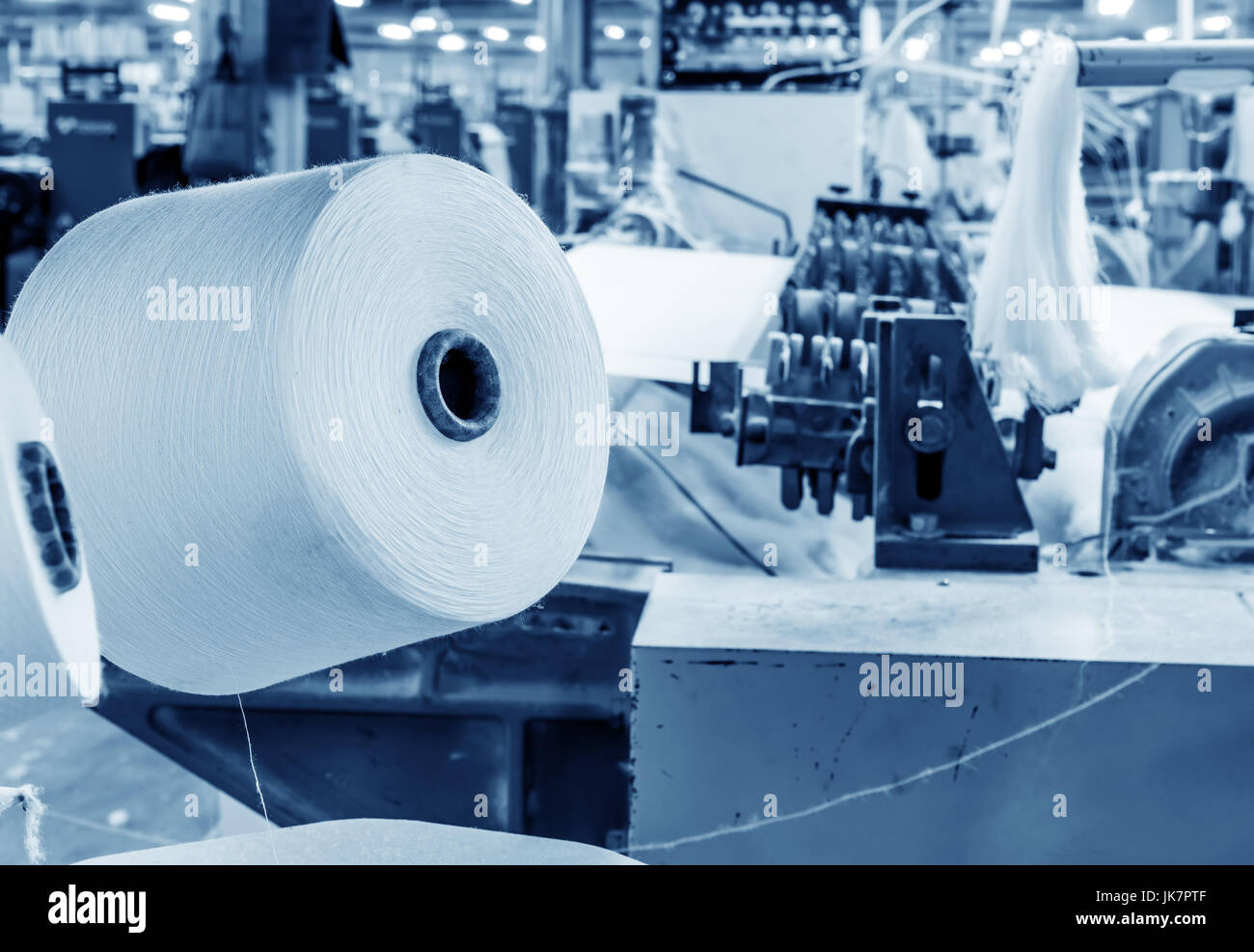 Detail of string reels in factory,blue tone map Stock Photo - Alamy