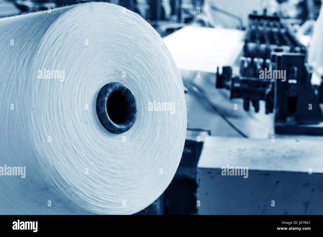 Detail of string reels in factory,blue tone map Stock Photo - Alamy