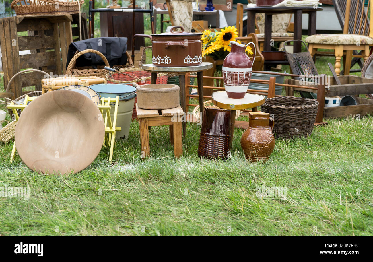 Flea market stall with vases, dishes, furniture and crates Stock Photo ...