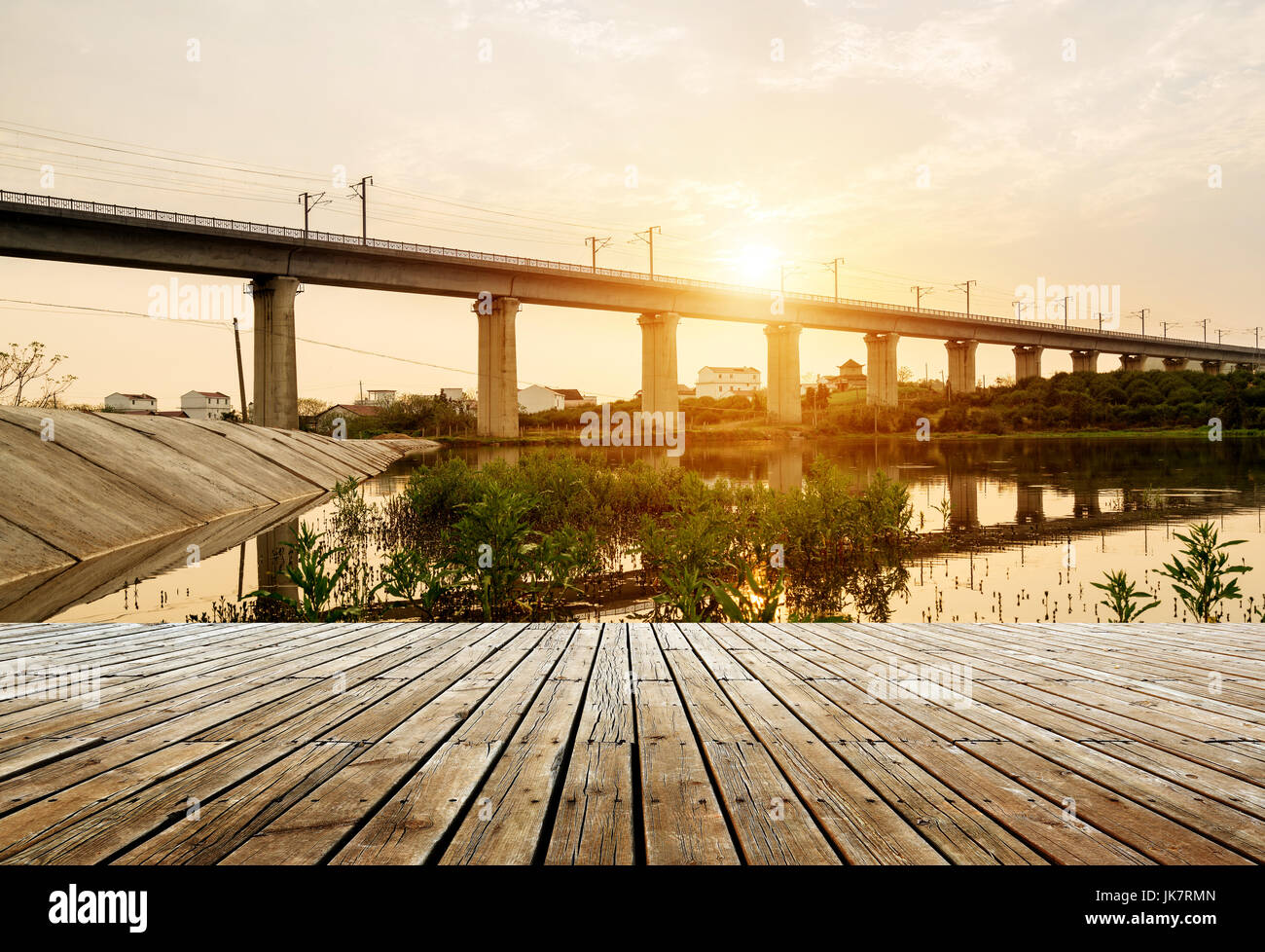 Wooden platform in front of the train viaduct, dusk landscape Stock ...