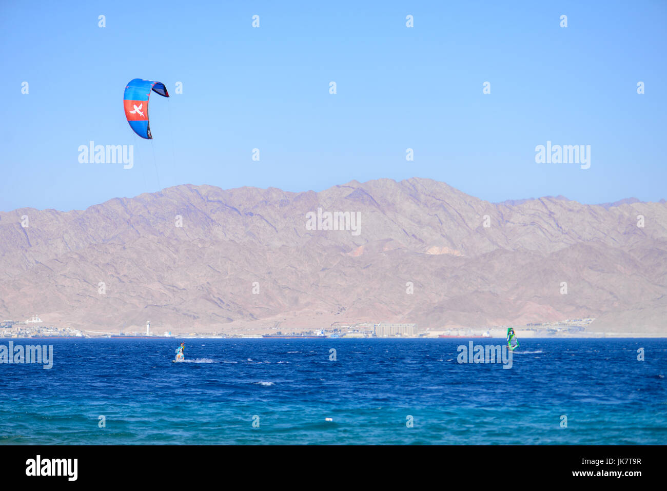 people wind surf in the red sea with mountains background Stock Photo ...