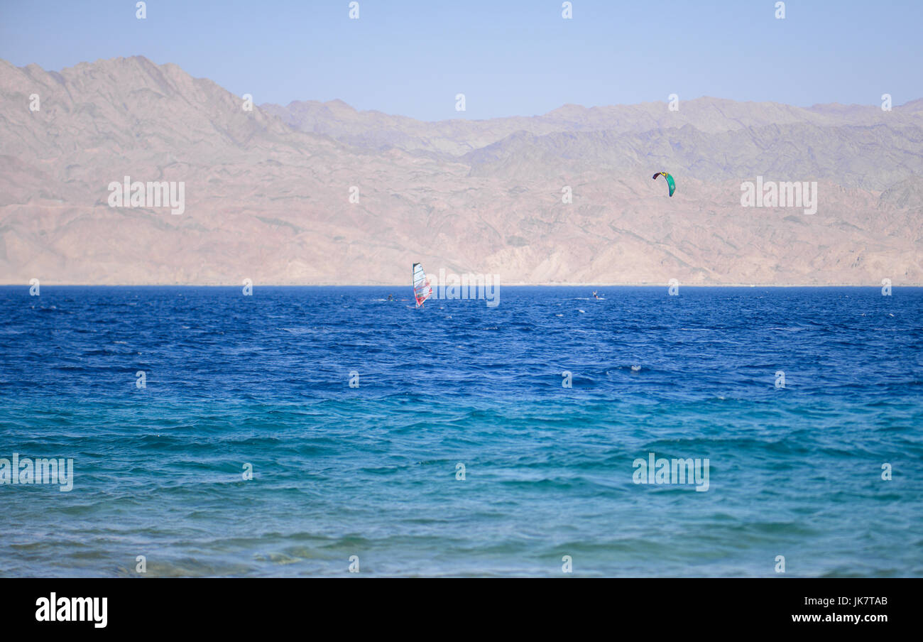 people wind surf in the red sea with mountains background Stock Photo ...