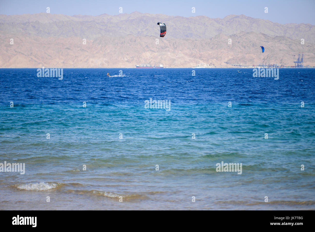 people wind surf in the red sea with mountains background Stock Photo ...
