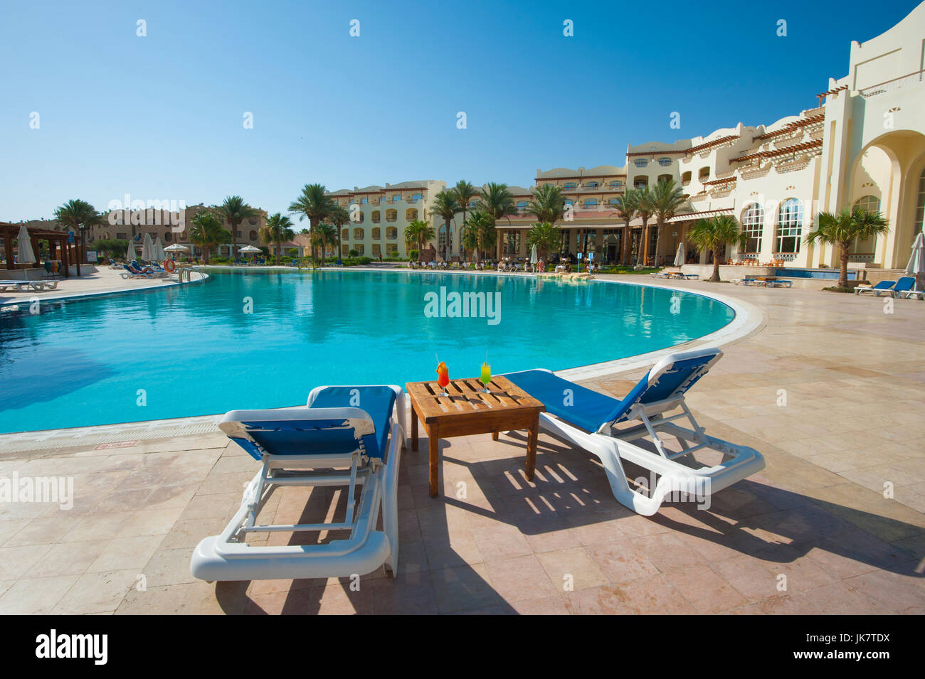 Large outdoor swimming pool at luxury tropical resort hotel in summer ...