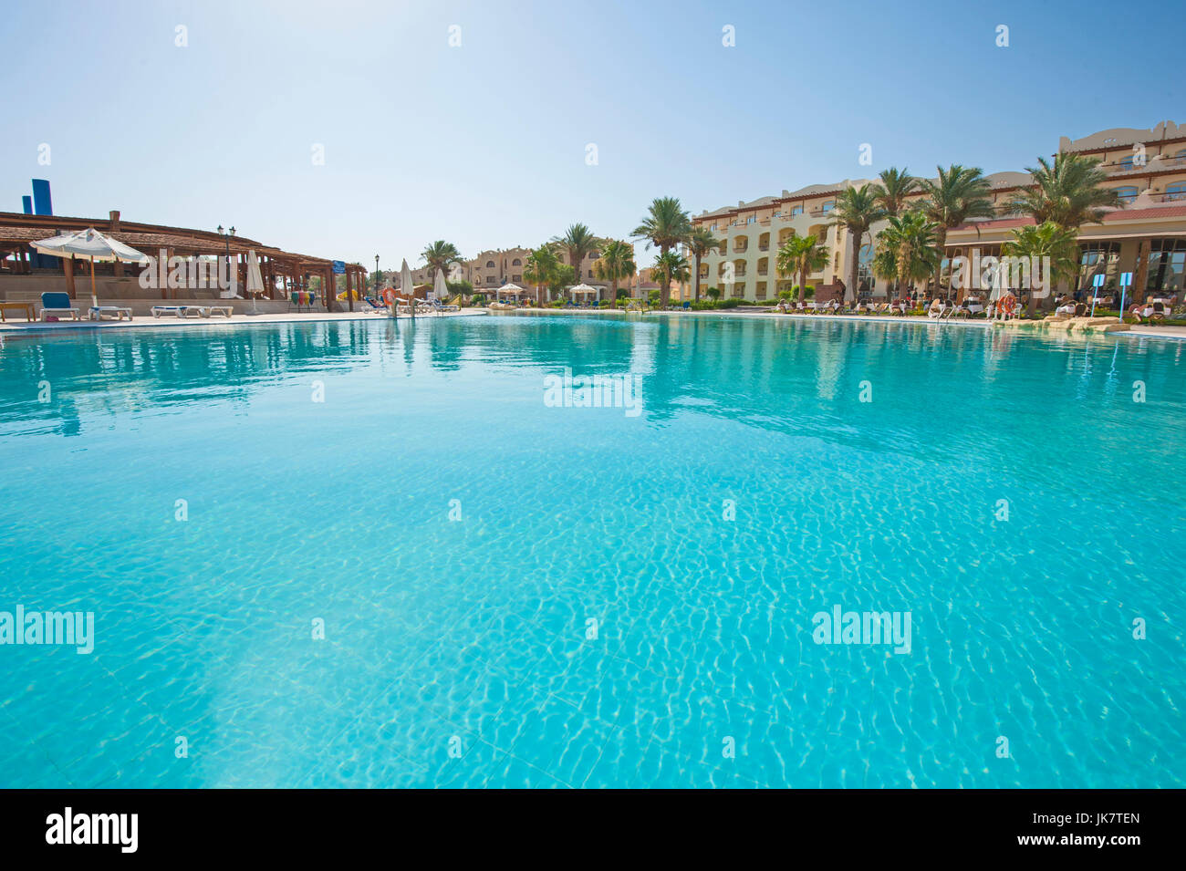 Large outdoor swimming pool at luxury tropical resort hotel in summer ...