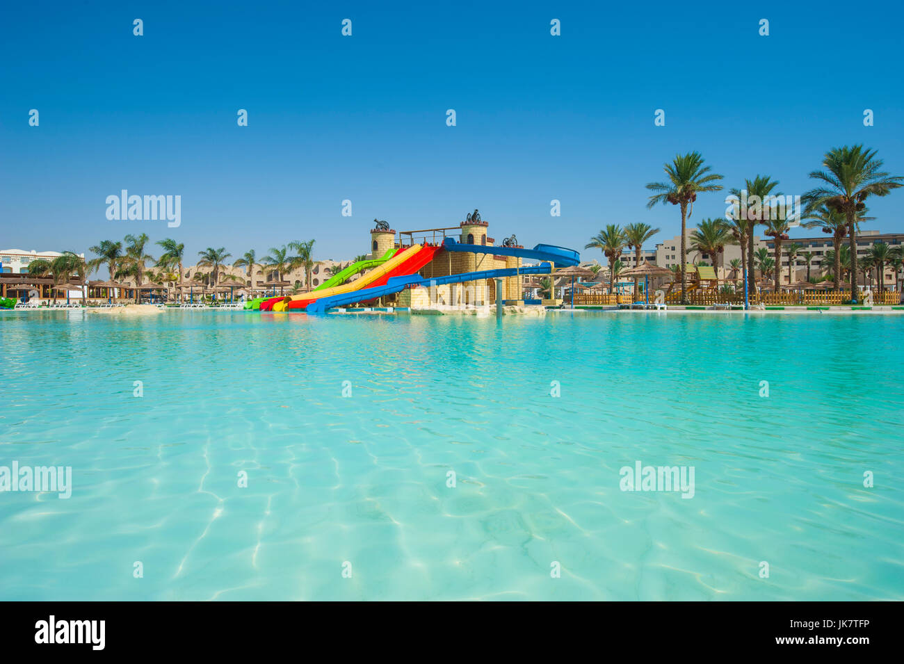 Large outdoor swimming pool at luxury tropical resort hotel in summer ...