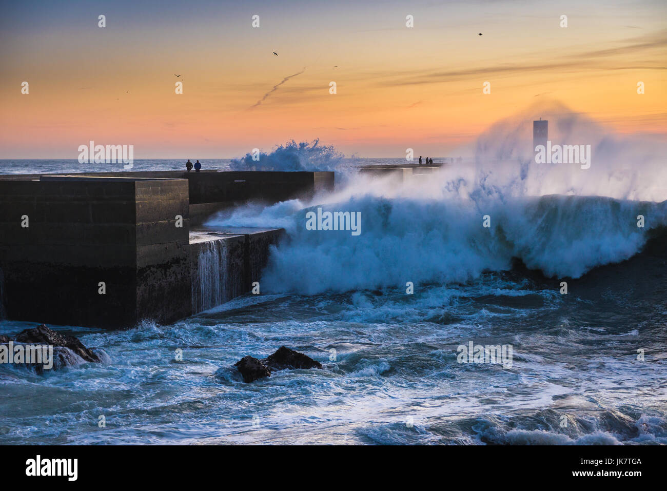 Atlantic Ocean wave crashing on rocks and breakwater in Foz do Douro ...