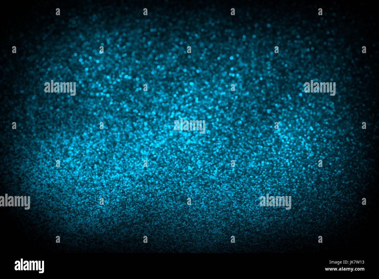 Abstract blue defocused glitter holiday background with dark vignette ... Abstract blue defocused glitter holiday background with dark vignette ...