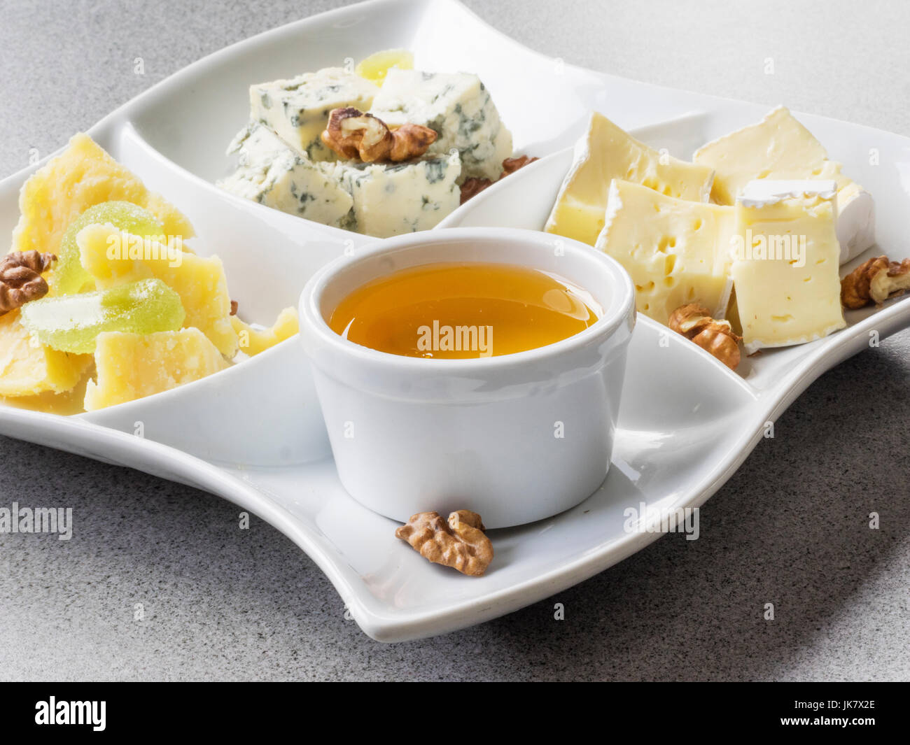 Various types of cheese set with honey and nuts Stock Photo - Alamy