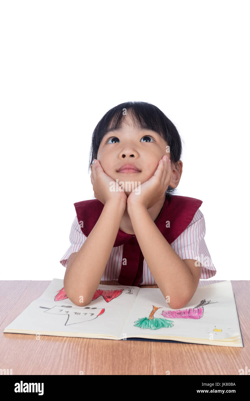 Asian Little Chinese girl reading a painting book in isolated white ...