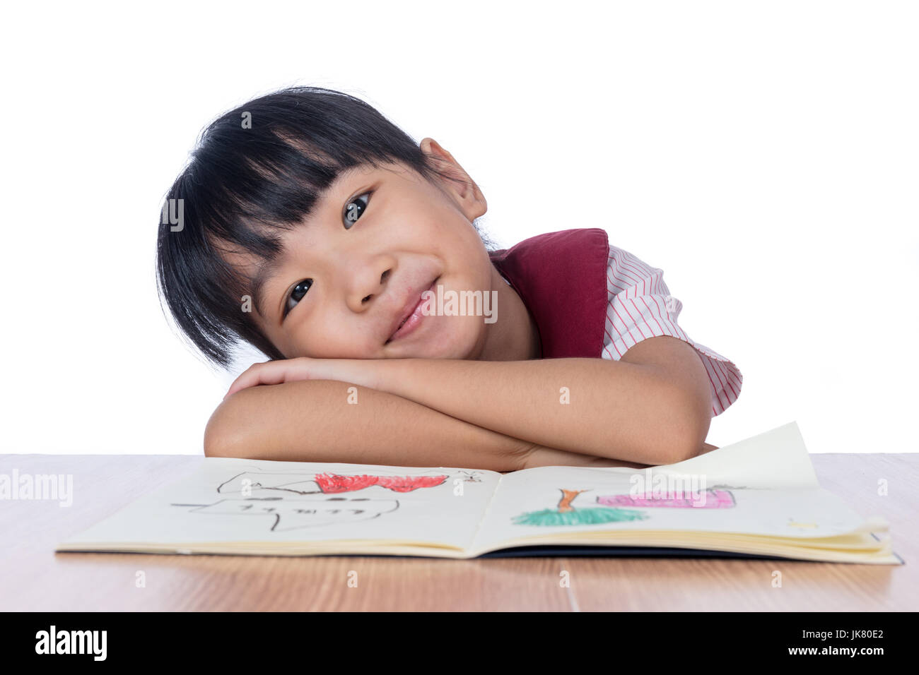 Asian Little Chinese girl reading a painting book in isolated white ...