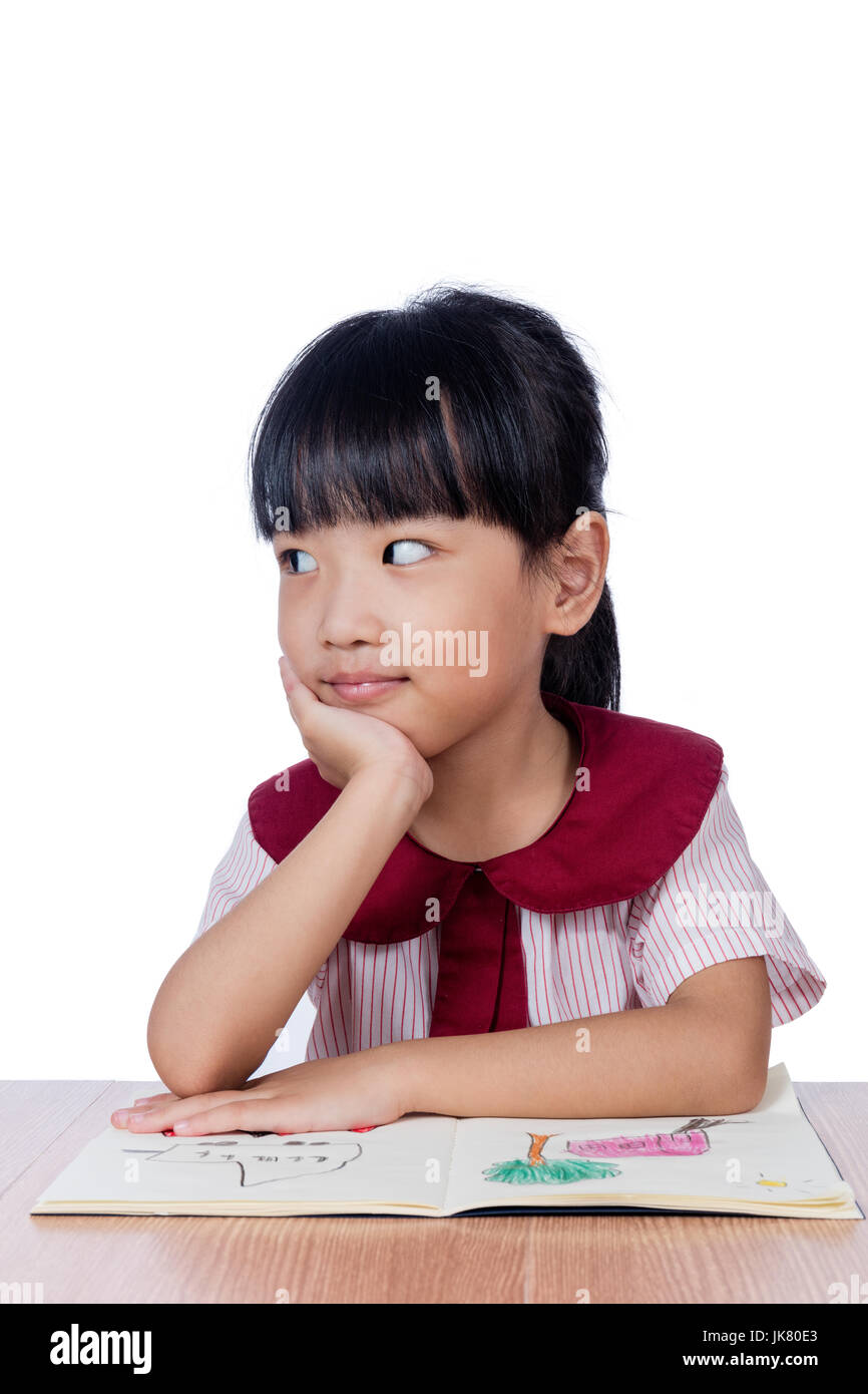 Asian Little Chinese girl reading a painting book in isolated white ...