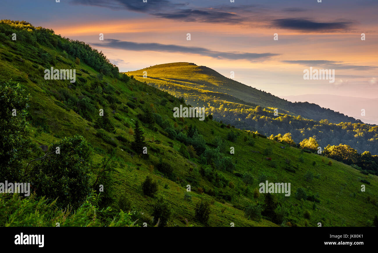 mountain ridge with peak behind the hillside. beautiful summer ...
