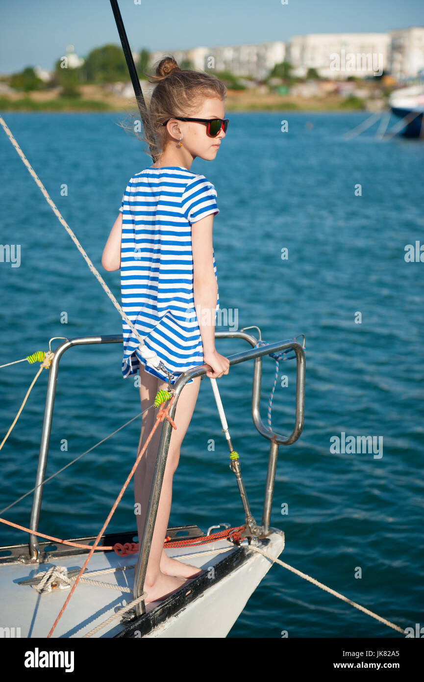 fashionable little girl aboard luxury boat in summer sea cruise Stock ...