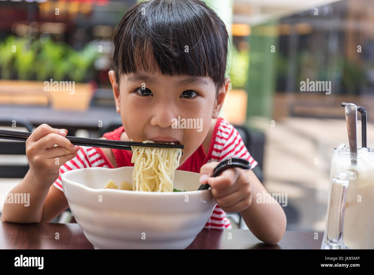 Chinese child eating noodles hi-res stock photography and images - Alamy