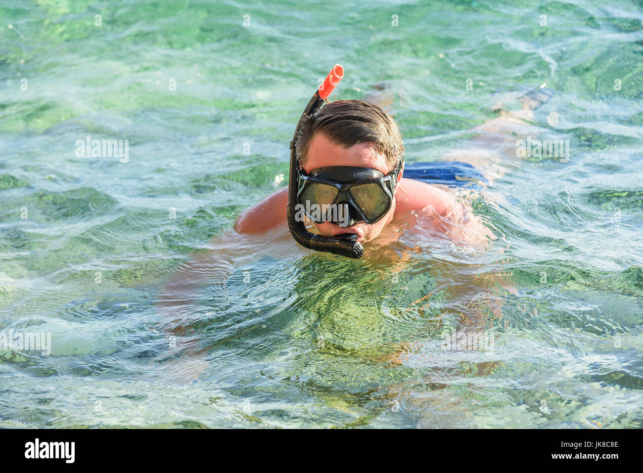 Man in a diving mask in sea water Stock Photo - Alamy