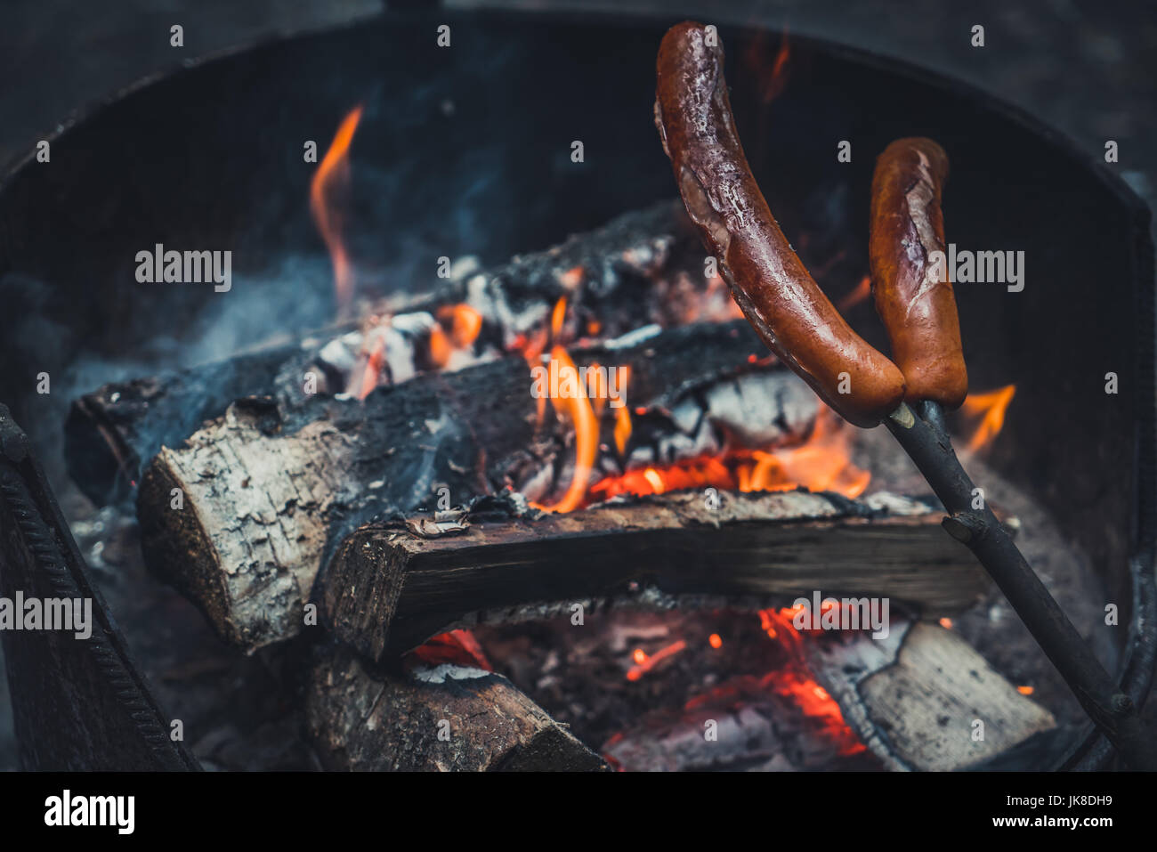Sausages cooking on grill in hi-res stock photography and images - Alamy