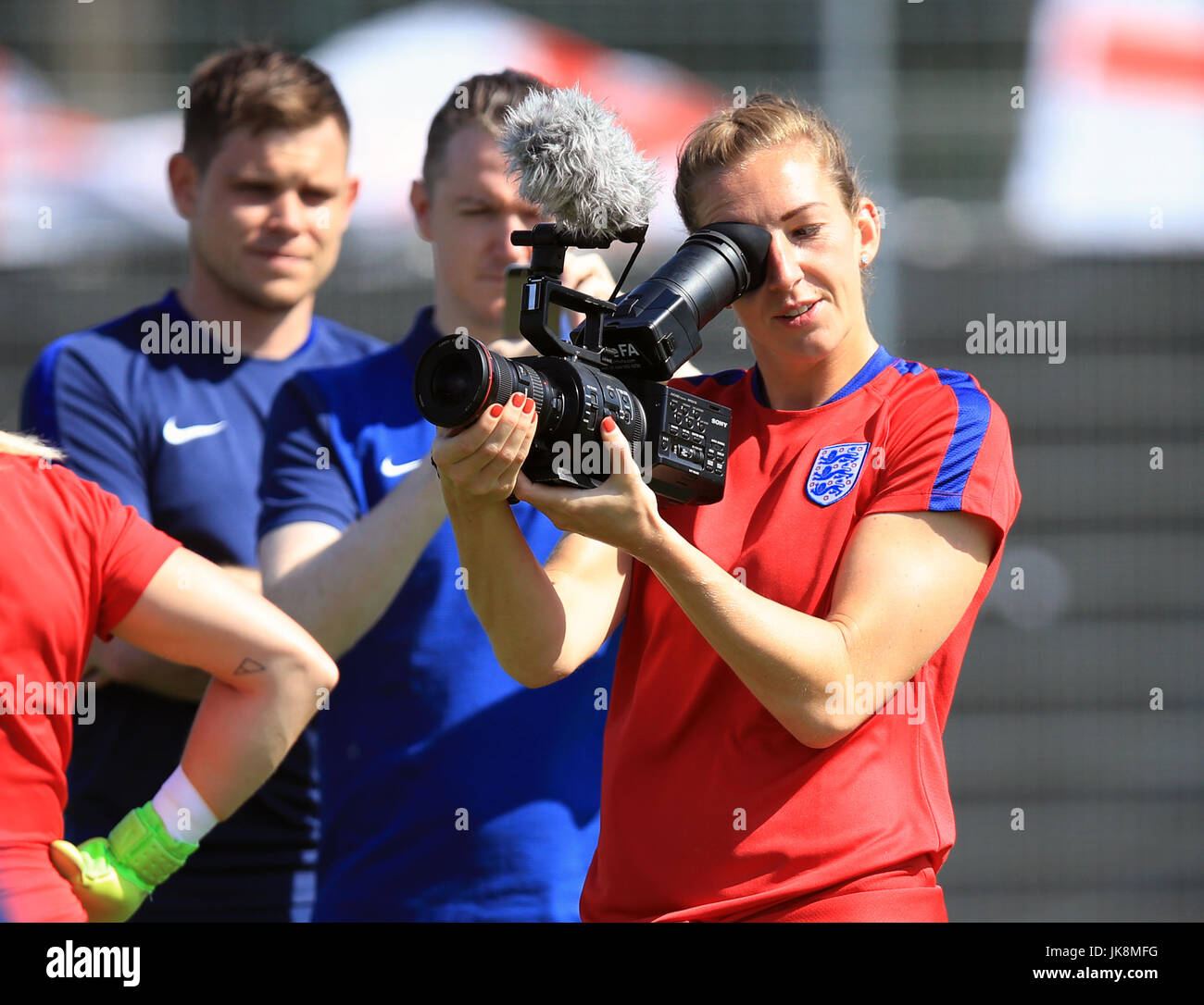 England goalkeeper Siobhan Chamberlain films the session on a camera ...