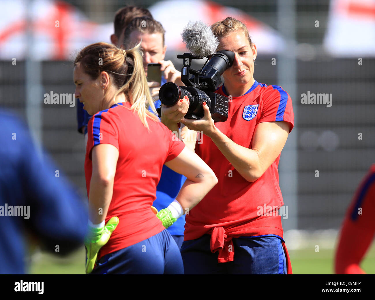 England goalkeeper Siobhan Chamberlain films the session on a camera ...