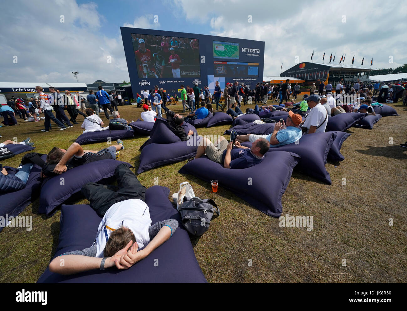 Fans watch the action on giant screens during day three of The Open ...