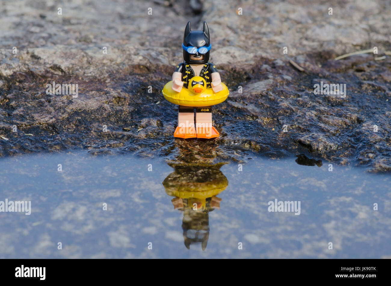 vacation batman with reflection on water Stock Photo - Alamy