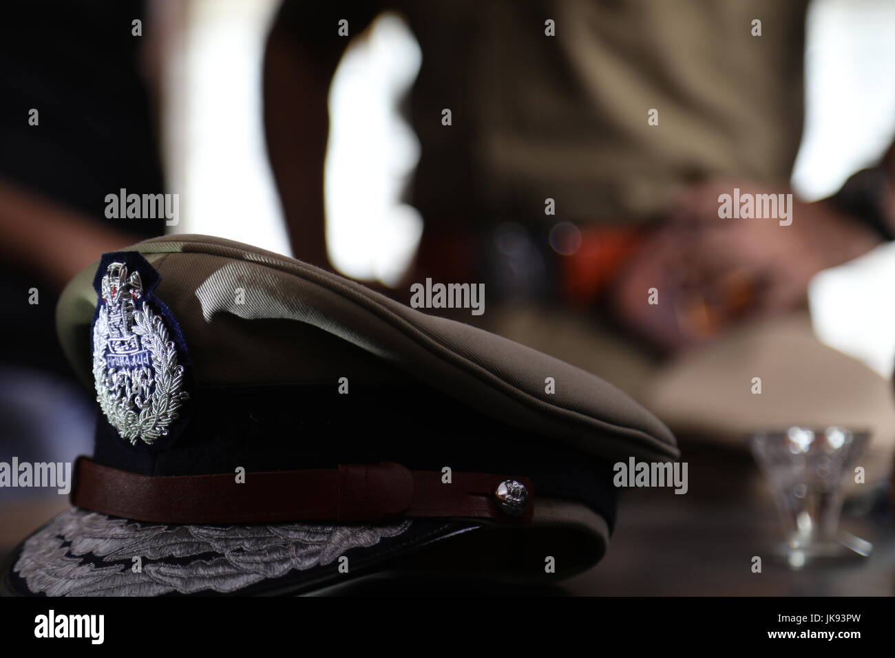 Police Hat on the table Stock Photo - Alamy