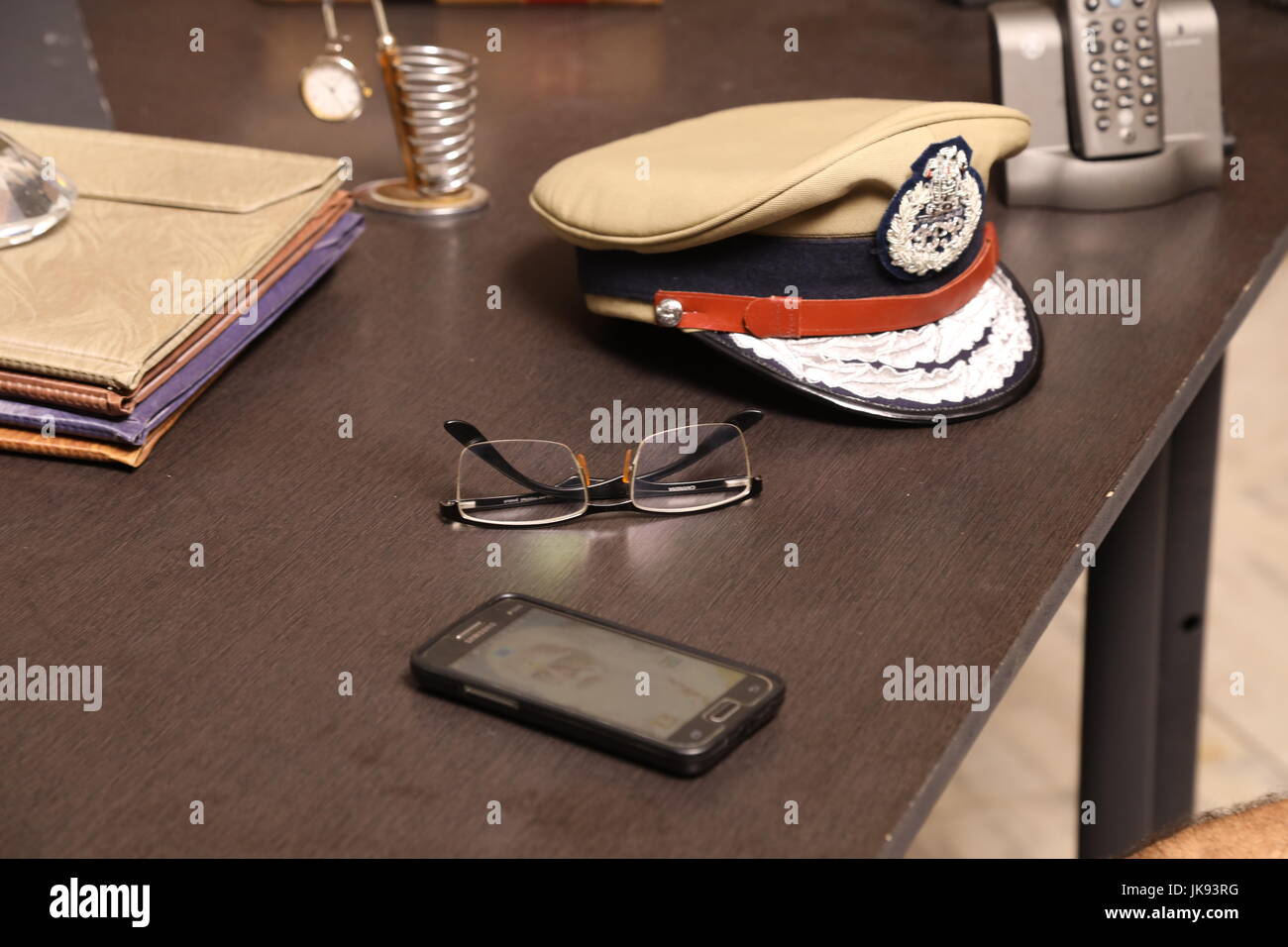 Police Hat on the table Stock Photo - Alamy