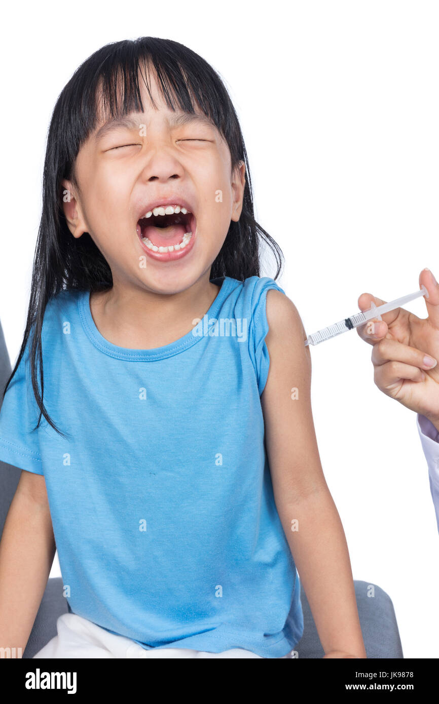 Asian little Chinese girl receiving an injection in isolated White ...