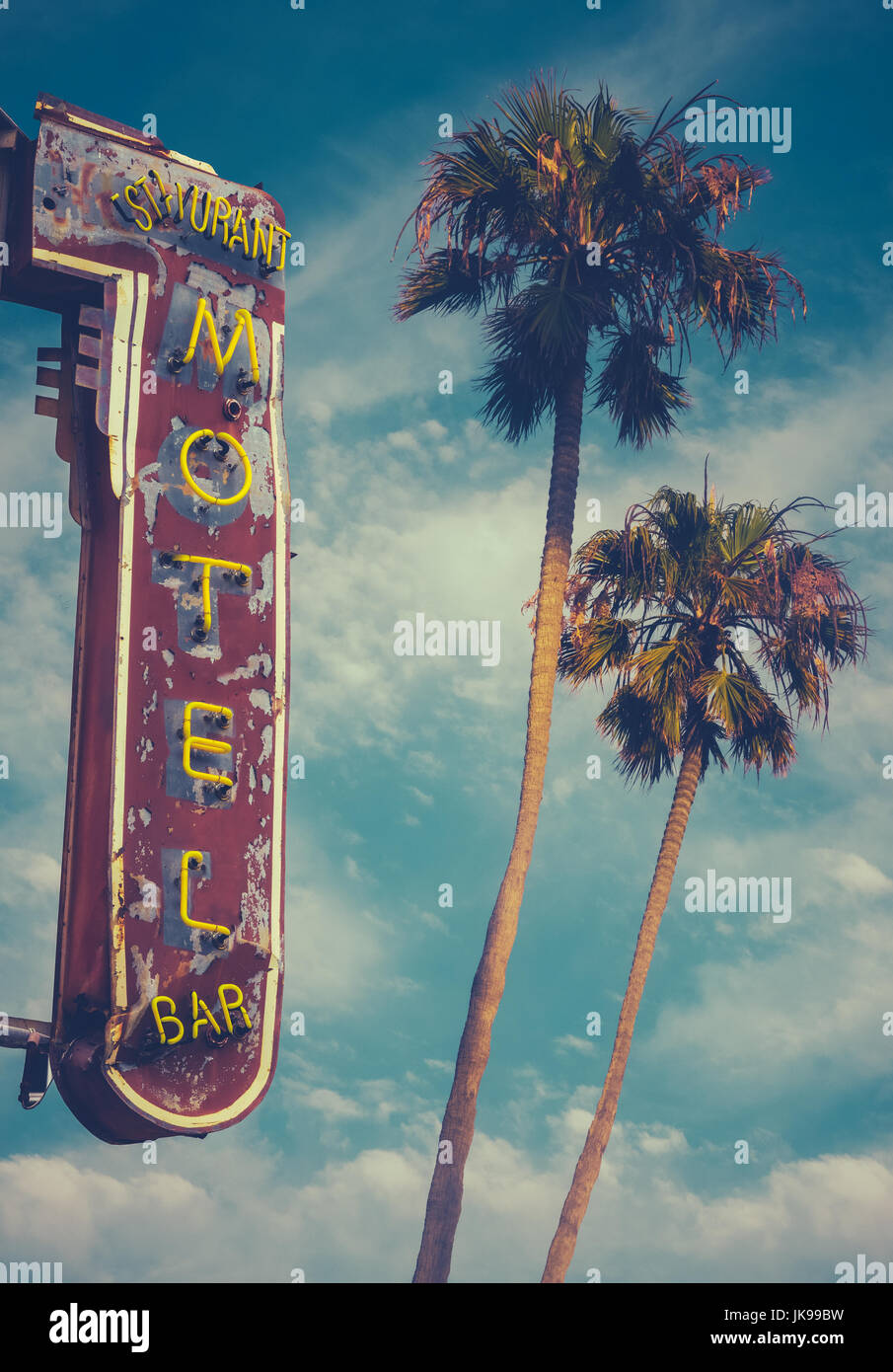 Retro Worn Vintage Neon Motel Sign And Palm Trees Stock Photo - Alamy