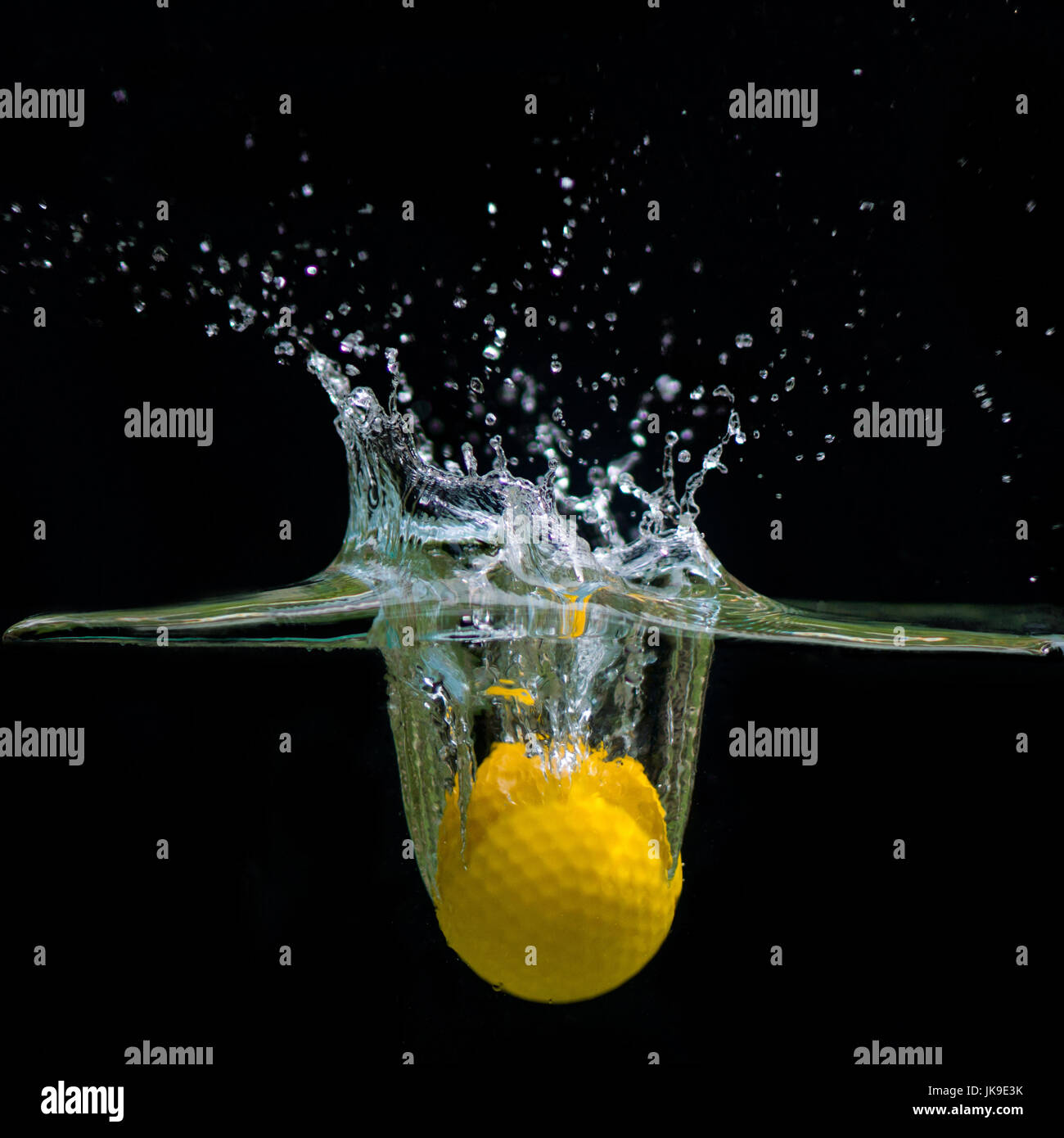 Golf ball splashing water hi-res stock photography and images - Alamy