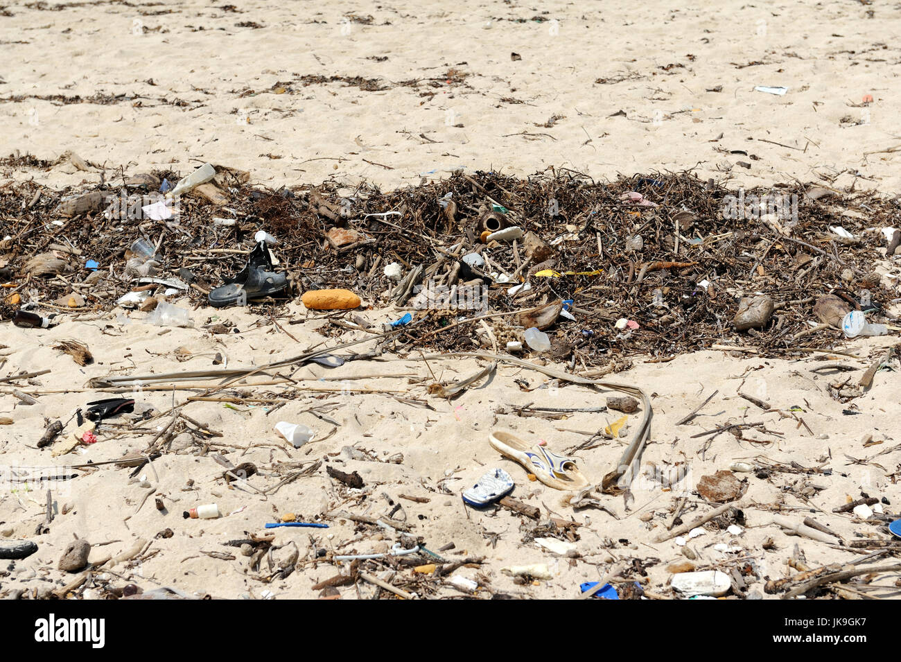 Trash on beach. Waste on the sands causes environmental pollution Stock ...