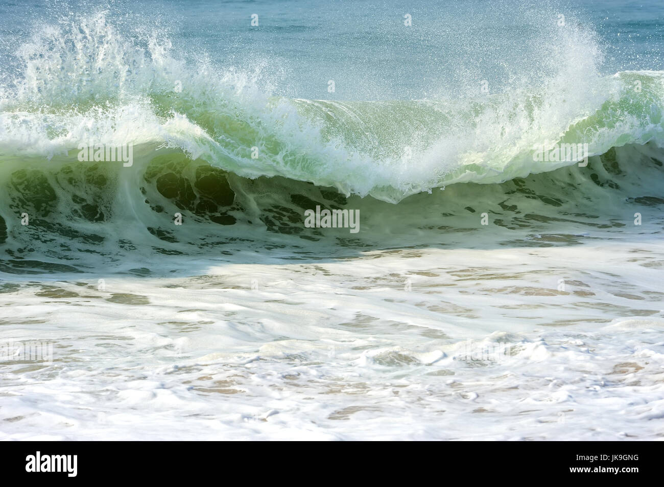 Wave of the ocean on the sand beach Stock Photo - Alamy