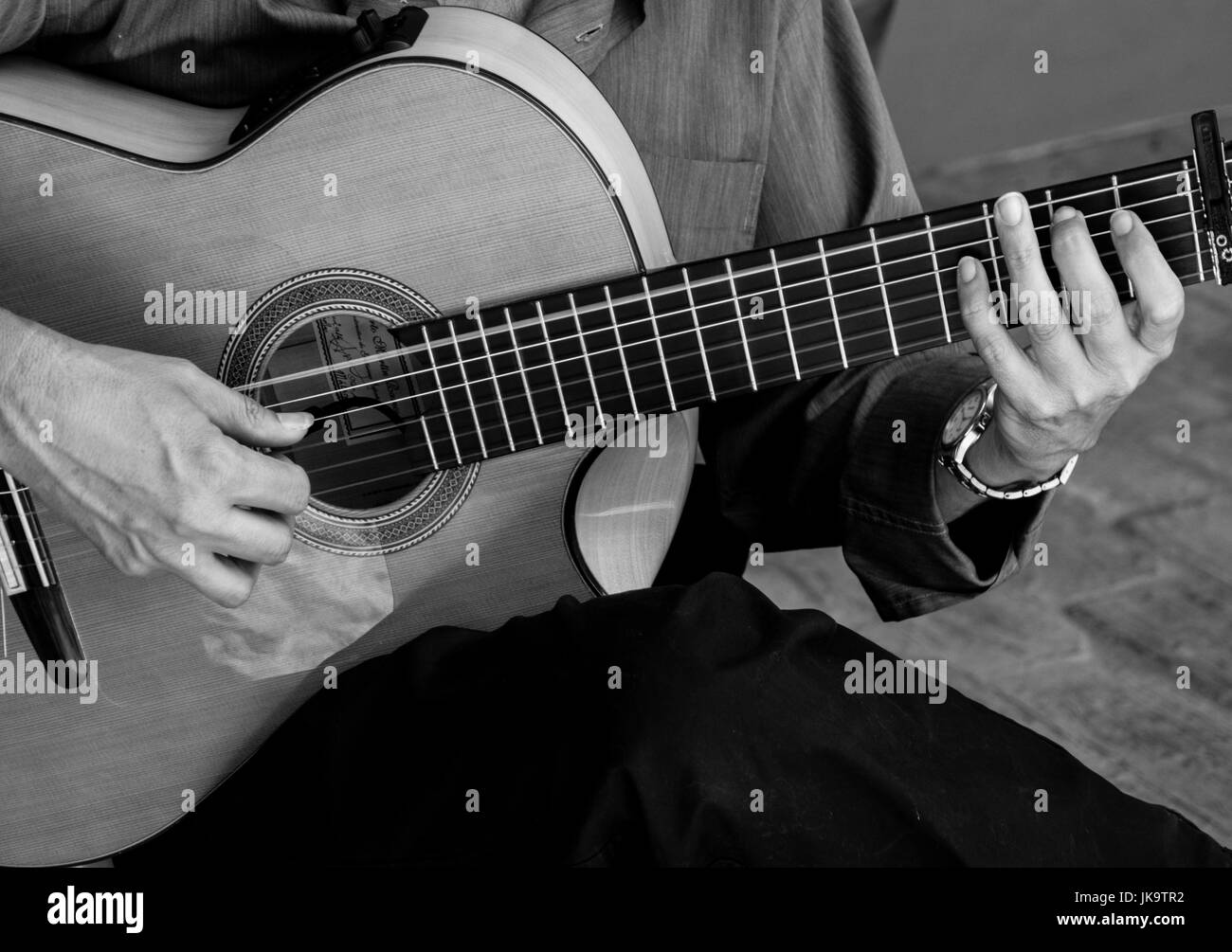 Acoustic Guitar being played Stock Photo - Alamy