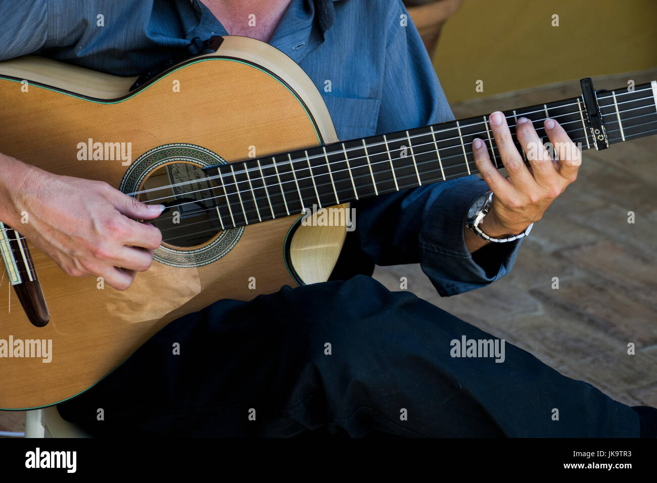 Acoustic Guitar being played Stock Photo - Alamy