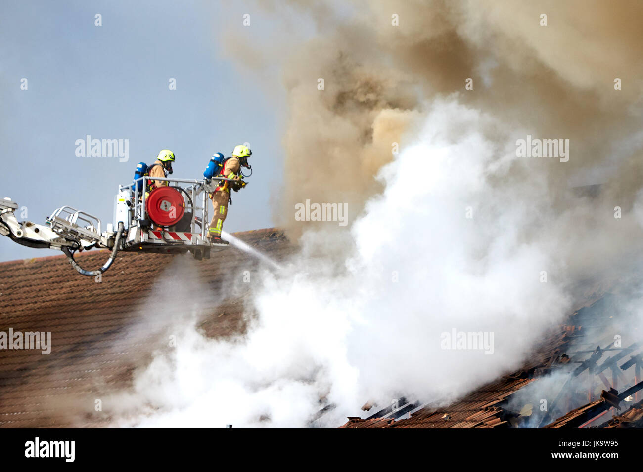 Firefighters tackle a blaze in the roof of an Asda supermarket in ...