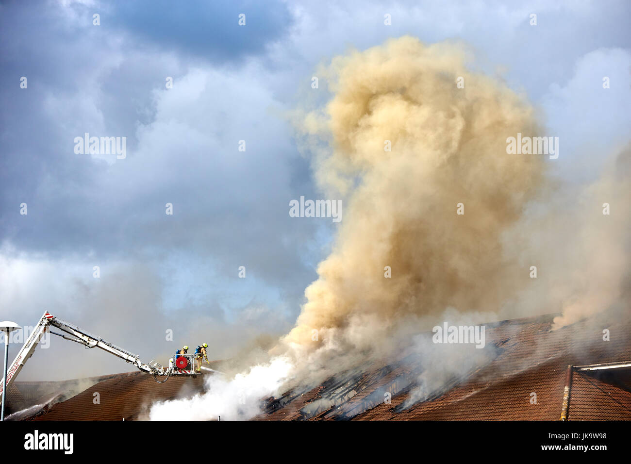 Firefighters tackle a blaze in the roof of an Asda supermarket in ...
