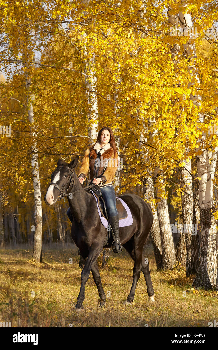 Beautiful woman riding black horse hi-res stock photography and images ...