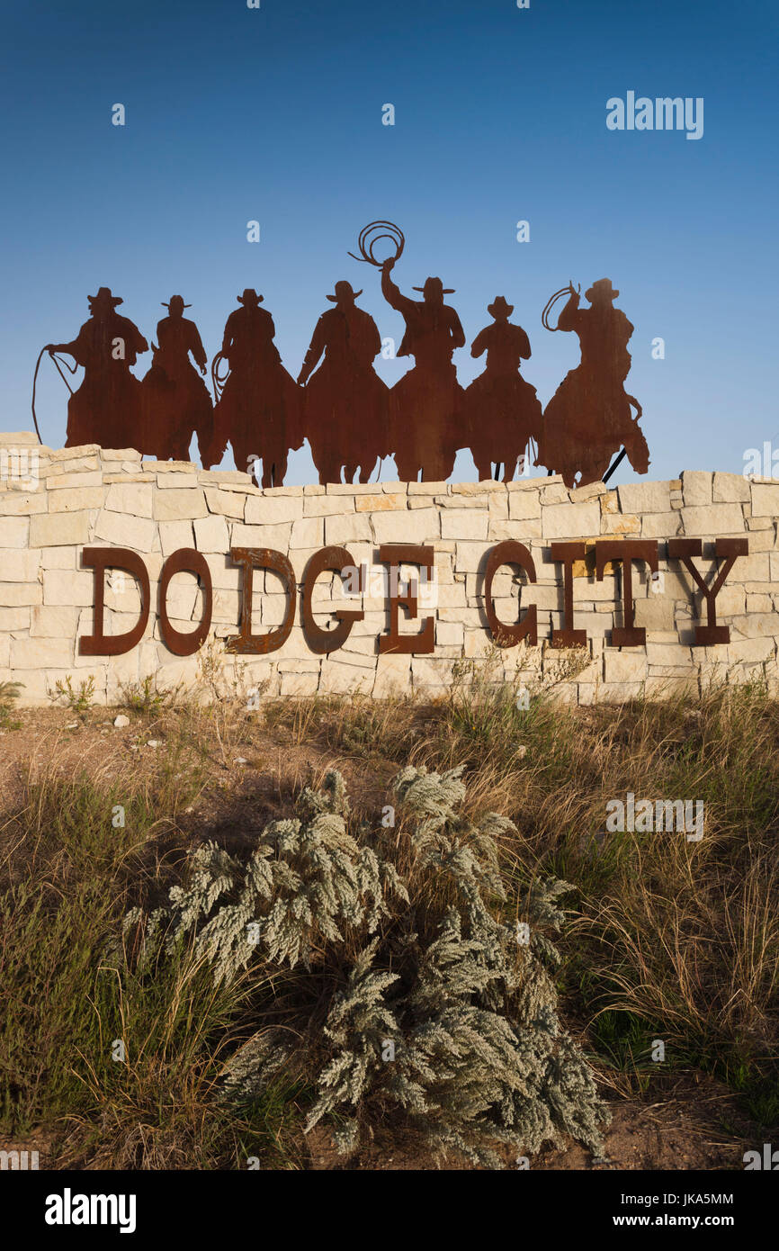 USA, Kansas, Dodge City, city sign with cowboy silhouettes, late ...
