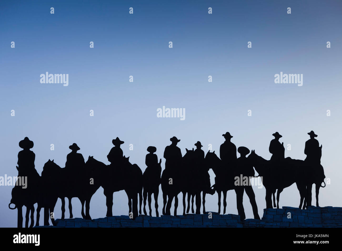 USA, Kansas, Dodge City, cowboy silhouettes, late afternoon Stock Photo ...