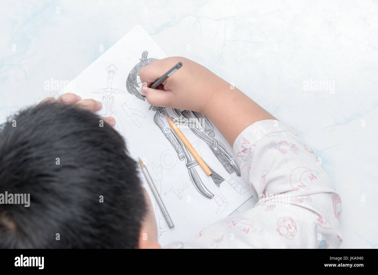 school boy drawing picture with color pencil, education concept Stock ...