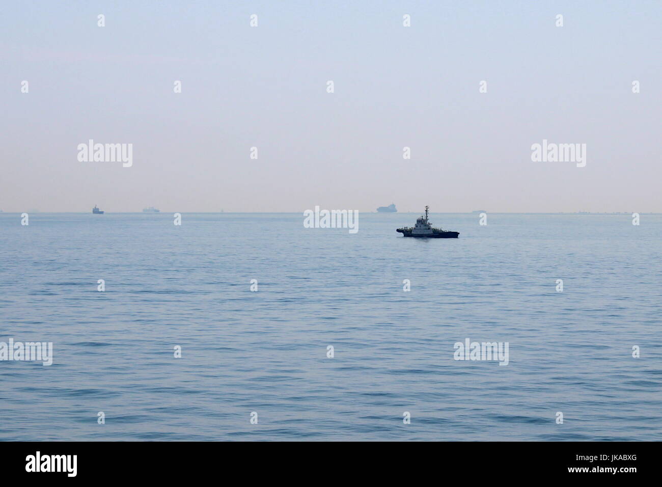 A boat moves alongside the Tokyo-wan ferry on the way to Futsu terminal ...