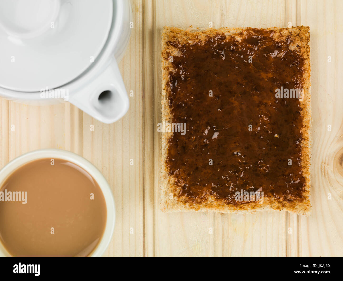 Beef Extract Spread on Toast Against a Light Natural Wooden Background ...