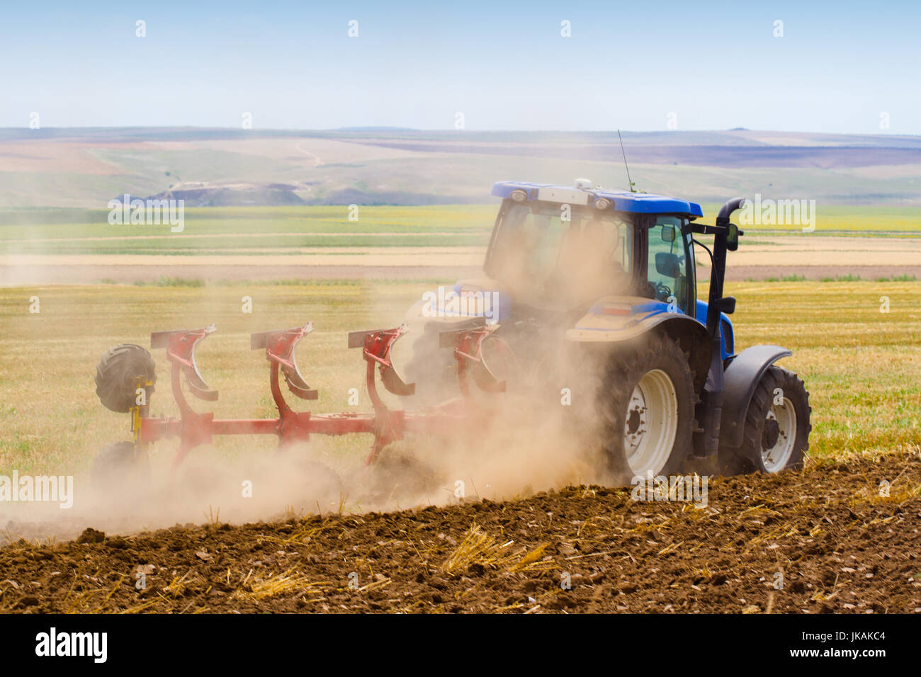 Side view of tractor with plough hi-res stock photography and images ...