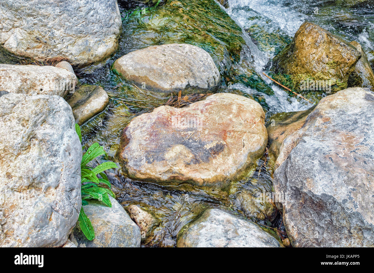 Soft nature background. Medium size rocks of Mijares river. Overcast ...