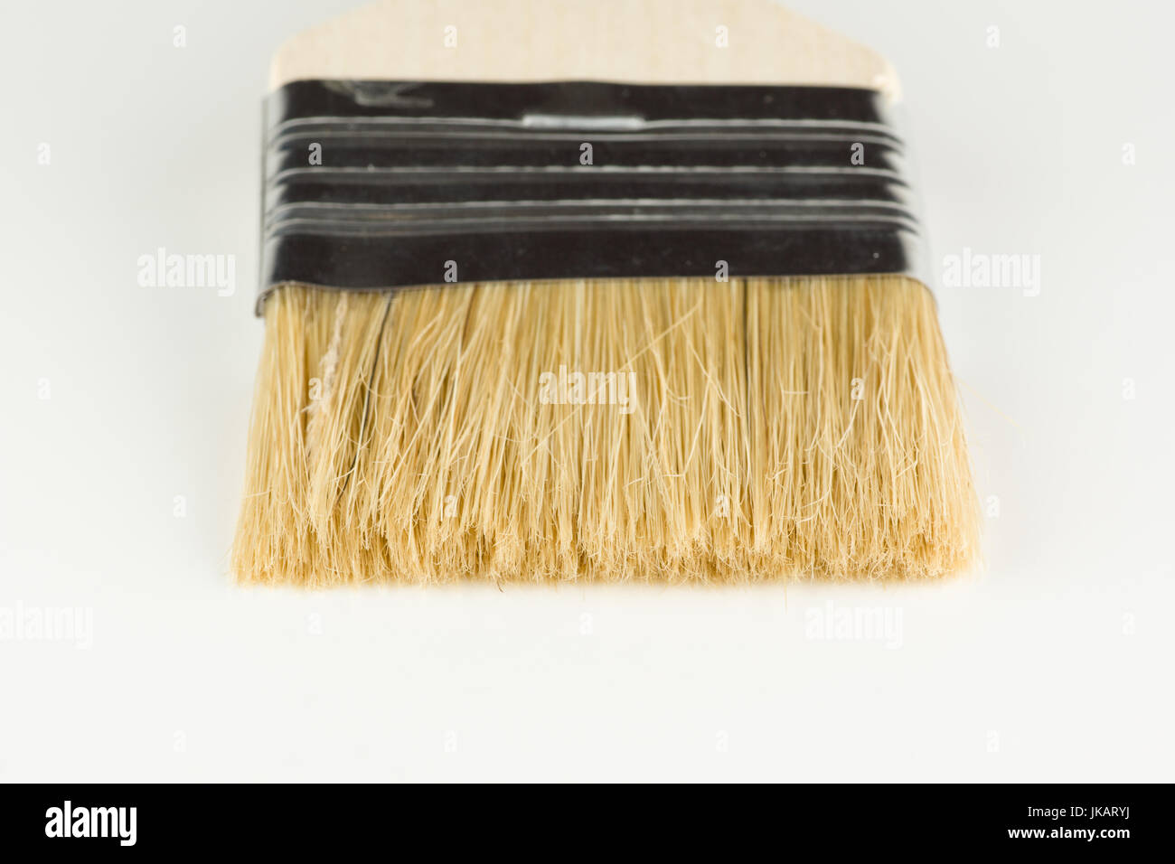 Large flat paint brush on white background Stock Photo - Alamy