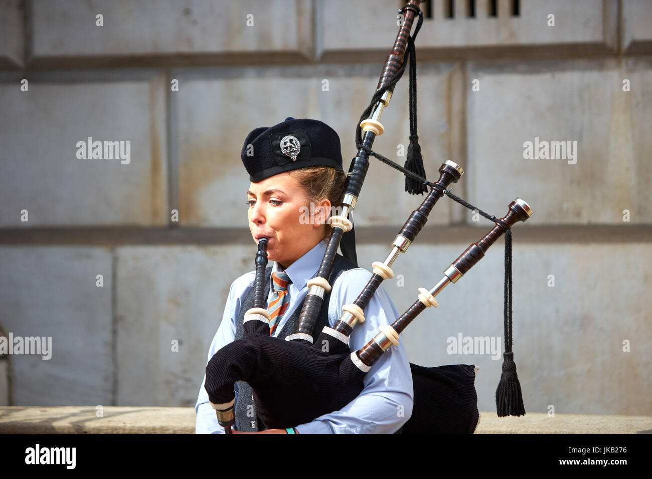 Woman playing the bagpipes hi-res stock photography and images - Alamy