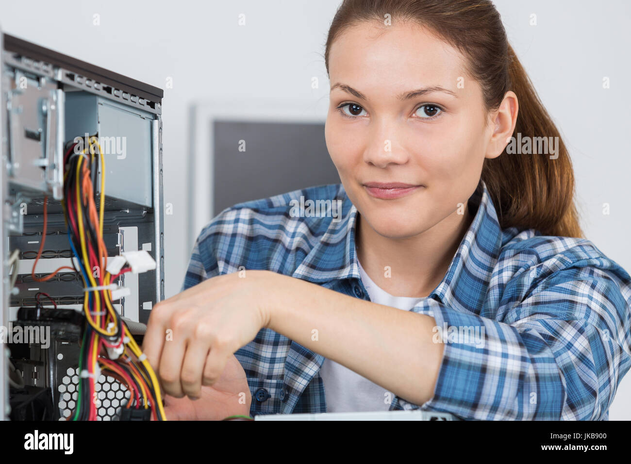 young woman testing computer components Stock Photo - Alamy