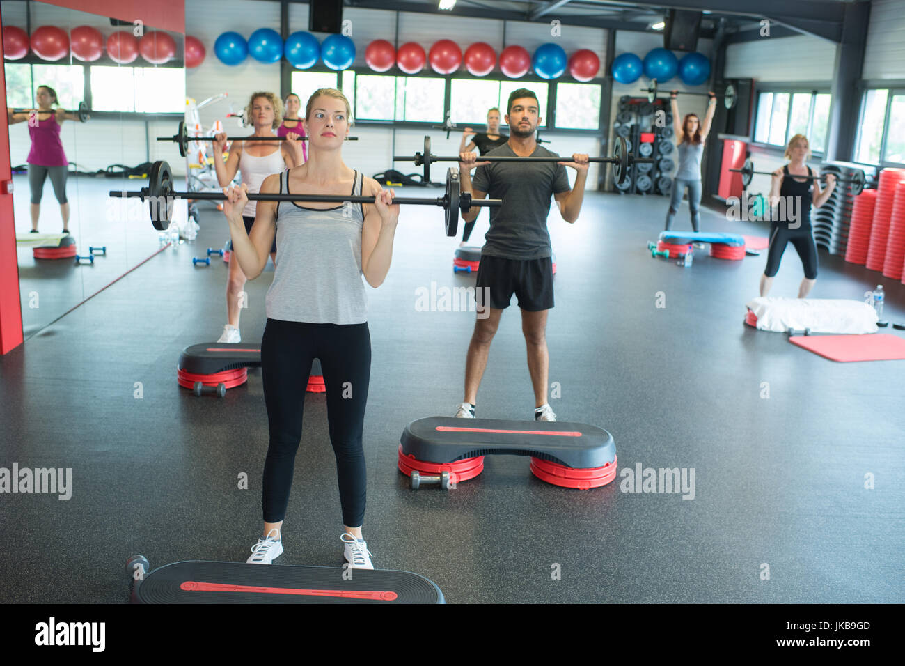 group of happy young people working out in sports club Stock Photo - Alamy